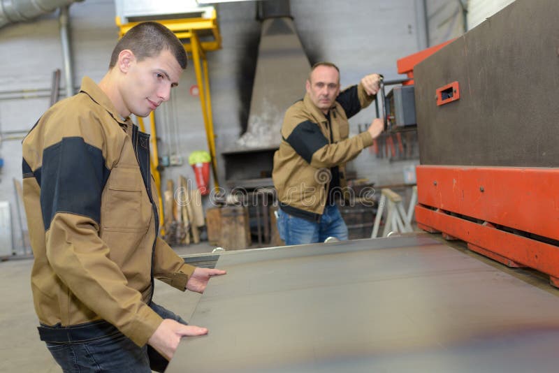 Busy male factory workers stock image. Image of teamwork - 117898949