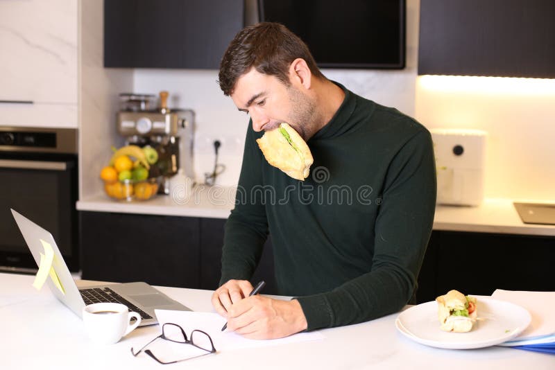 Busy Man Eating a Sandwich while on Conference Call Stock Image - Image ...
