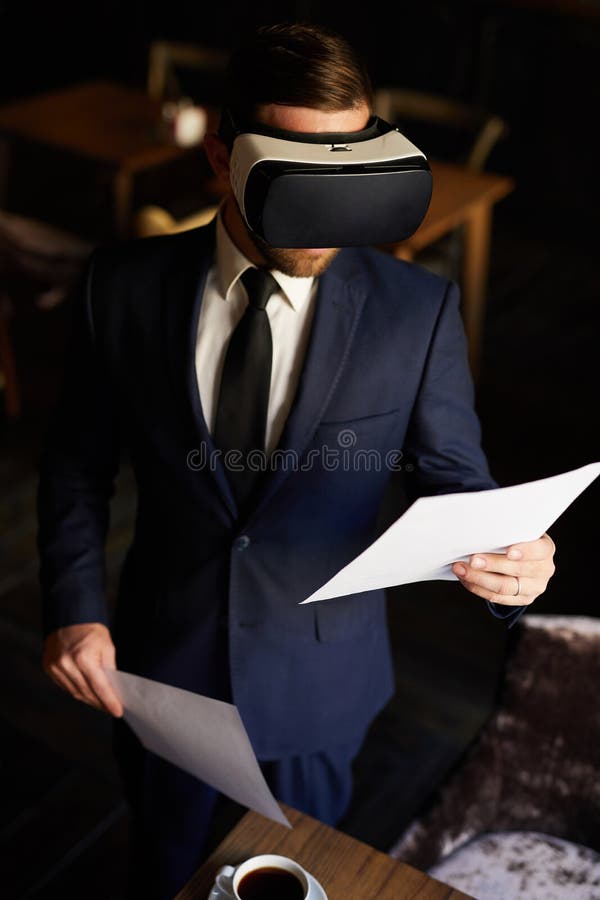Busy Man Reading Report in Interactive Goggles Stock Photo - Image of ...