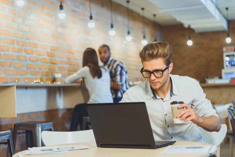 Busy Man Using Computer in Cafeteria Stock Photo - Image of device ...