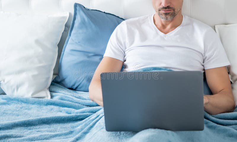 Busy Mature Man Working on Laptop in Bed Stock Image - Image of ...
