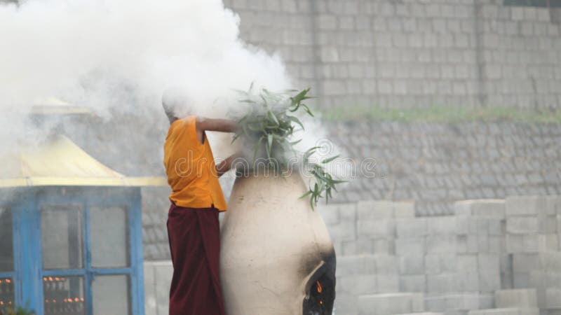 Busy Monk with Fire and Smoke Stock Photo - Image of green, statue ...