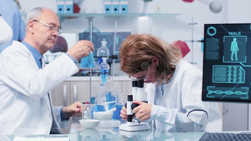 In Modern High End Laboratory Scientist in Coverall is Taking Various ...