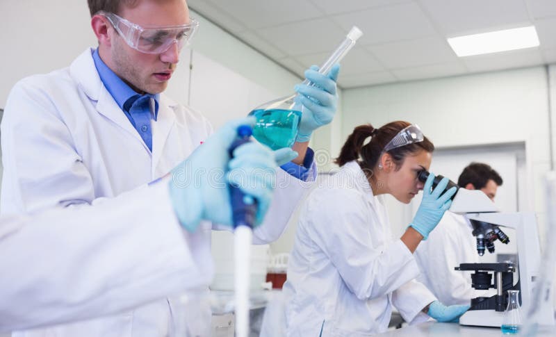 Busy Researchers Working on Experiments in Lab Stock Image - Image of ...