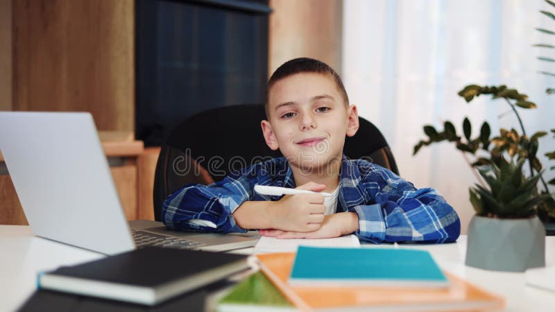 Busy School Boy Making Notes in Copybook during Online Classes at Home ...