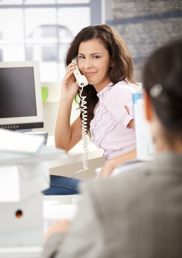 Busy Secretary Talking on Phone in Office Smiling Stock Photo - Image ...