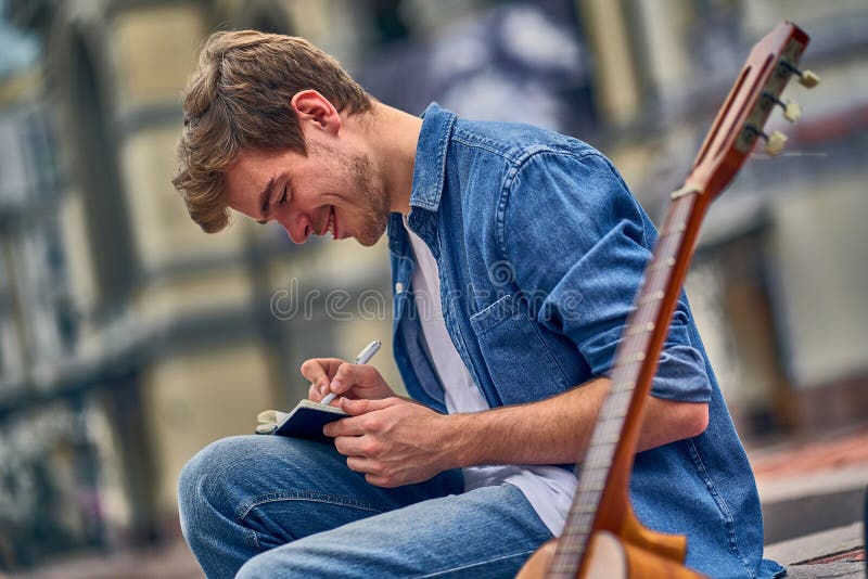 Busy Talented Musician Writes a New Song into Notebook Stock Photo ...
