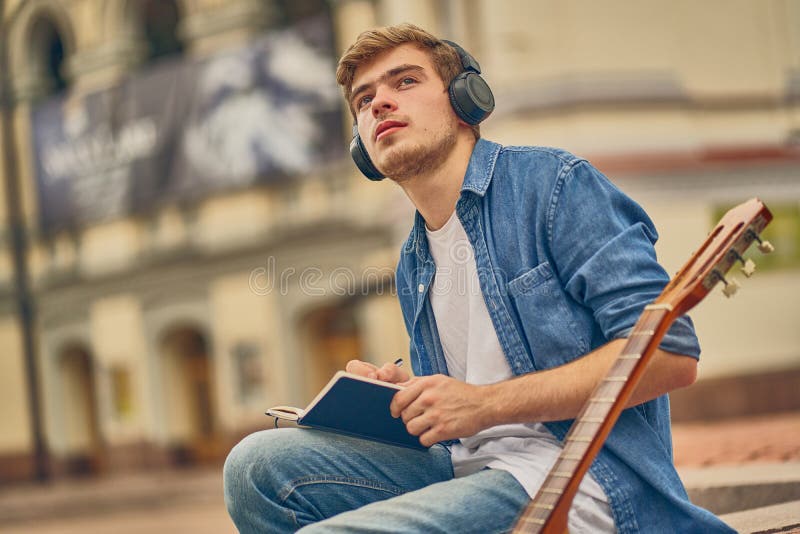 Busy Talented Musician Writes a New Song into Notebook Stock Photo ...