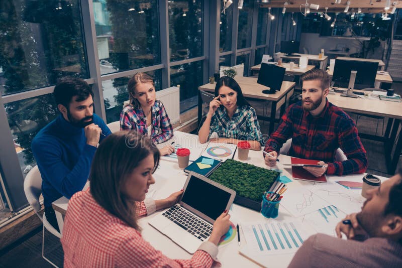 Smiling Creative Team with Laptop Working Hard in Office Stock Image ...