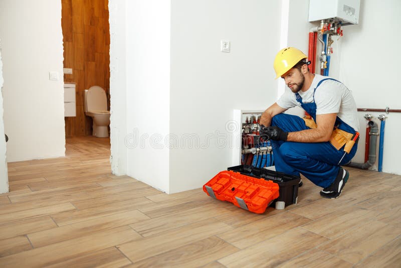 Busy Technician, Plumber in Protective Gloves Using Tools from Toolbox ...