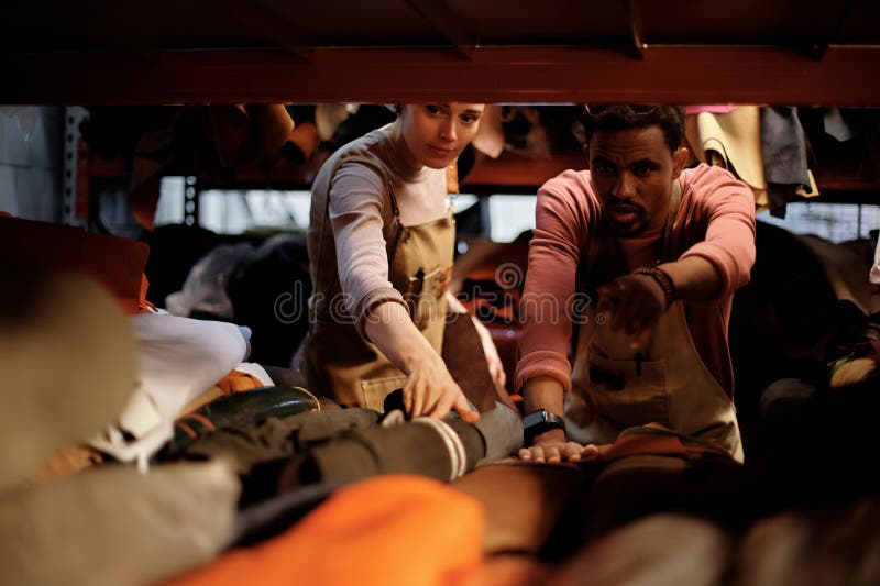Busy Warehouse Workers Sorting Clothes Stock Photos - Free & Royalty ...