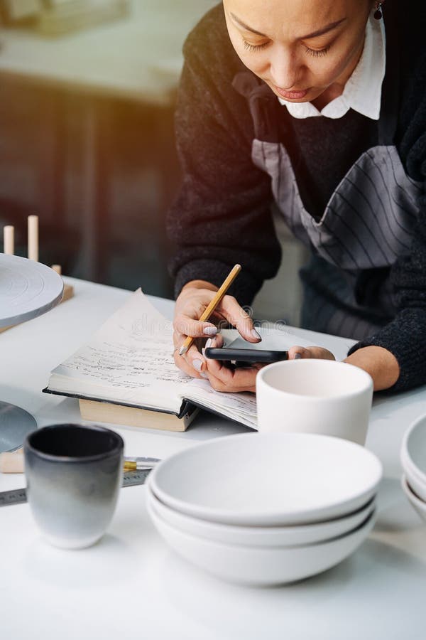 Busy Woman Working Behind the Table with New Blank Tableware, Texting ...