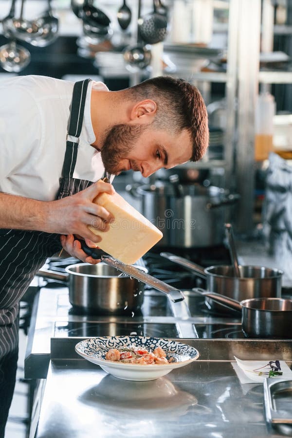 Busy at Work. Chef is on the Kitchen Preparing Food Stock Image - Image ...
