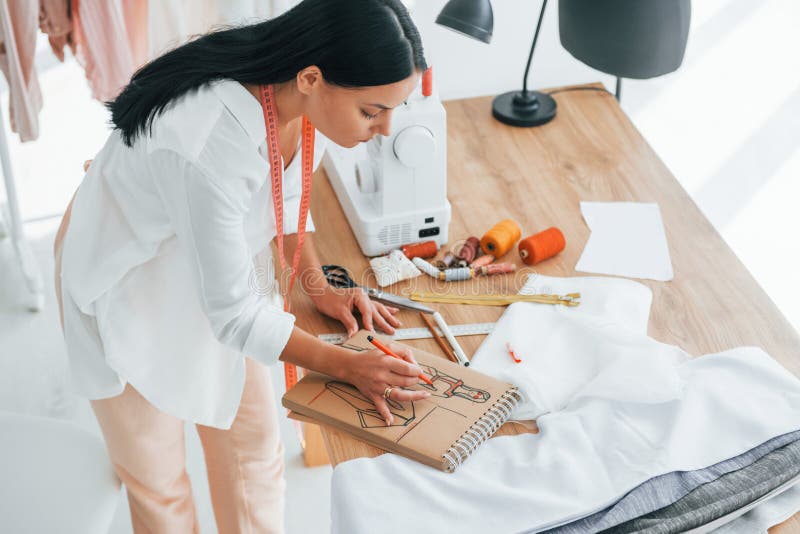 Busy at Work. Seamstress is in Her Office that is with Different ...