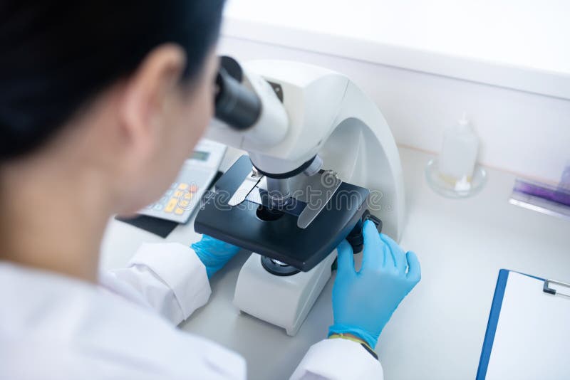 Worker of Biochemical Laboratory Looking in Microscope Stock Photo ...