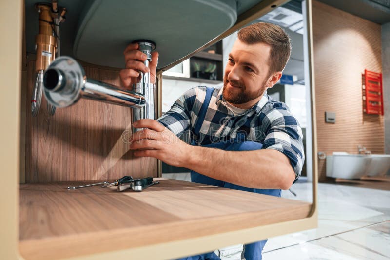 Busy Worker in Blue Uniform is in the Bathroom Stock Image - Image of ...