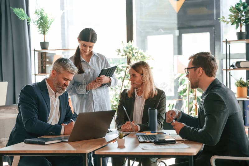 Busy Workers are by the Table. Group of Business People are in the ...