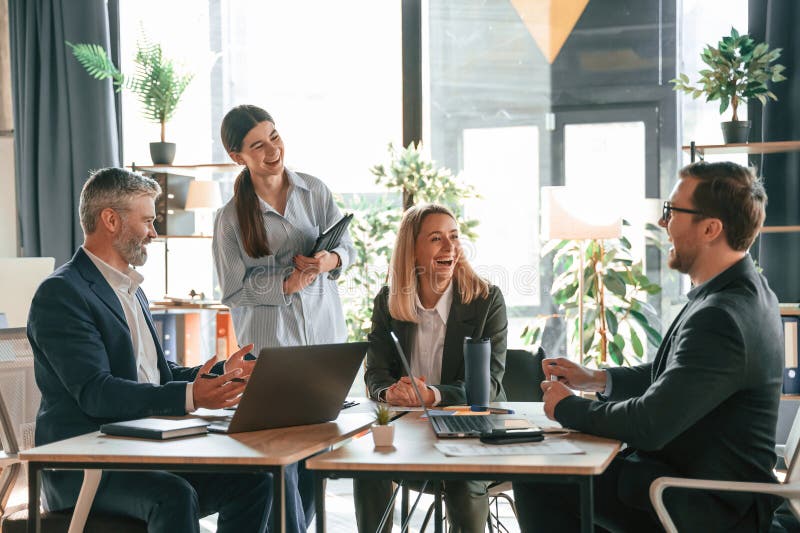 Busy Workers are by the Table. Group of Business People are in the ...