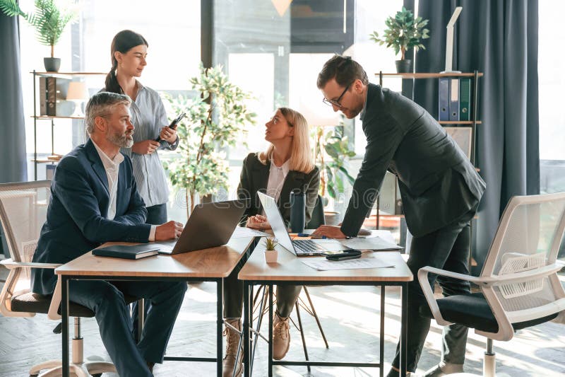 Busy Workers are by the Table. Group of Business People are in the ...