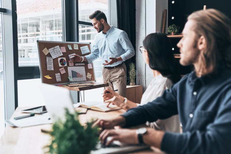 Busy Working Day. Group of Young Business People Using Blackboard with ...