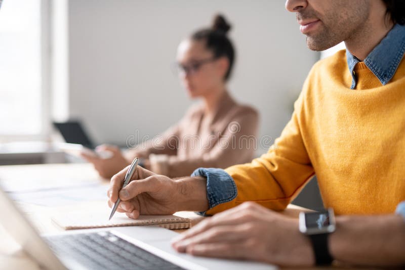 Busy Young Manager with Pen Over Page of Notepad Going To Write Down ...