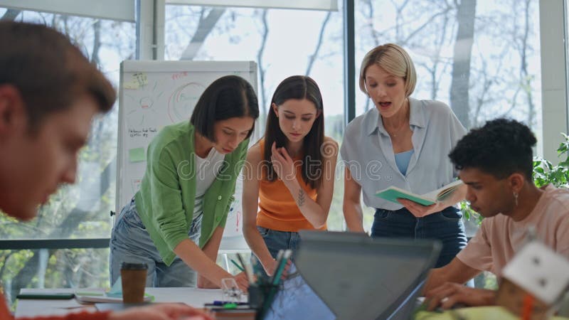 Busy Young Team Working in Workplace Together. Creative Coworkers ...