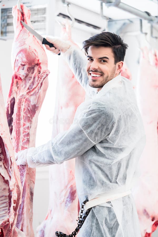 Butcher in Butchery or Slaughterhouse Cutting Meat Stock Image - Image ...