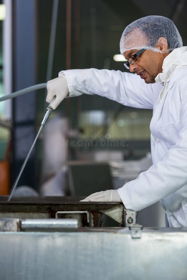 Butcher Cleaning Meat Processing Machine Stock Photo - Image of adult ...