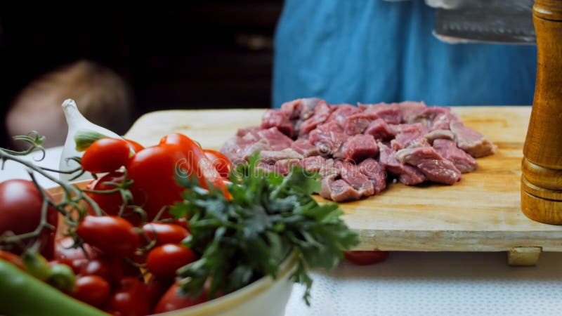 Butcher Cuts a Large Piece of Selected Meat on a Steel Table Stock ...
