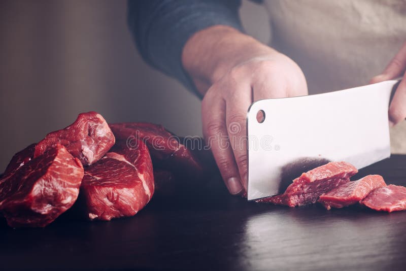 Butcher Hands Cutting with Knife Raw Meat Steak on Wooden Cutting Board ...