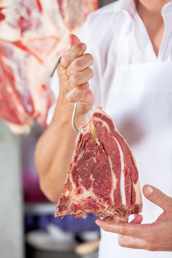 Butcher Holding Raw Meat with Hook Stock Photo - Image of butcher ...