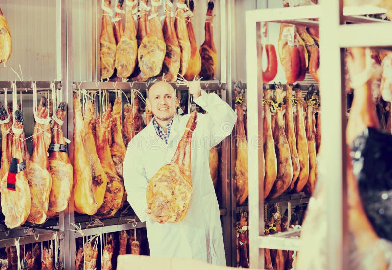 Butcher with jamon joints stock photo. Image of farm - 88584530