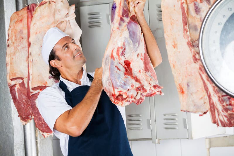 Butcher Looking at Raw Meat Stock Image - Image of prime, male: 49018167
