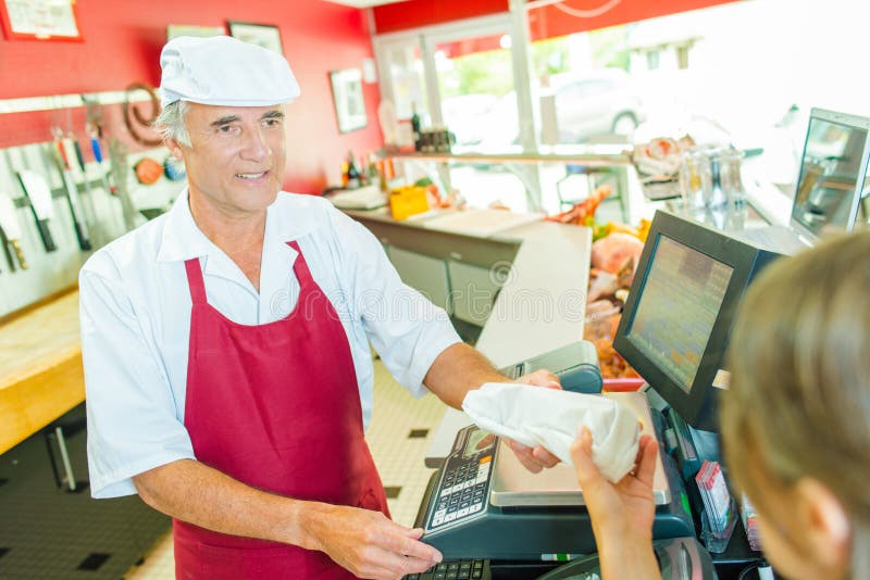 Butcher Passing Package To Customer Stock Image - Image of customer ...