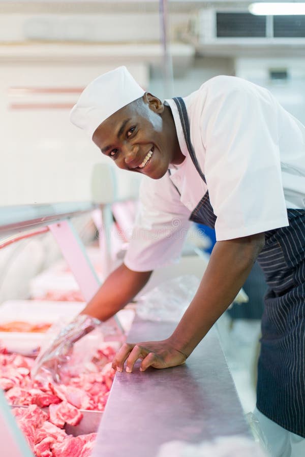 Butcher picking raw meat stock image. Image of market - 66564683