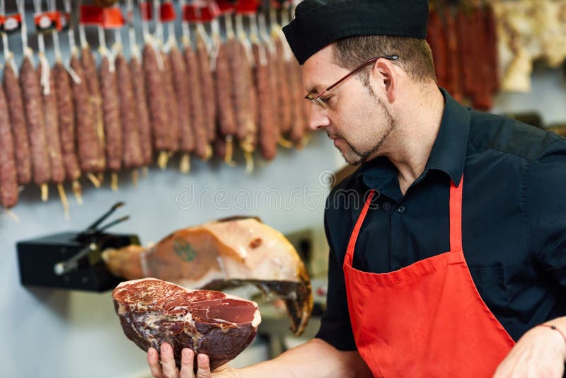 Butchers Boning a Ham in a Modern Butcher Shop Stock Photo - Image of ...