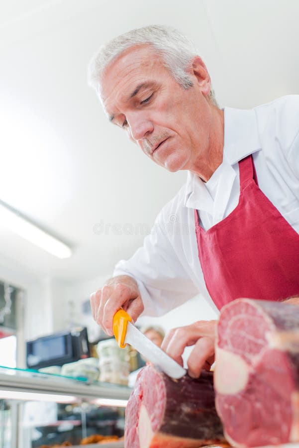 Butcher Preparing Some Meat Stock Photo - Image of loin, juicy: 123021162