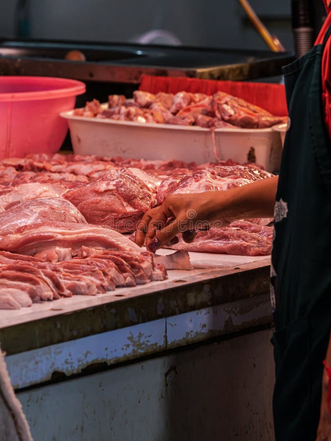 Butcher Selecting Pork at Market Stall Stock Image - Image of selection ...