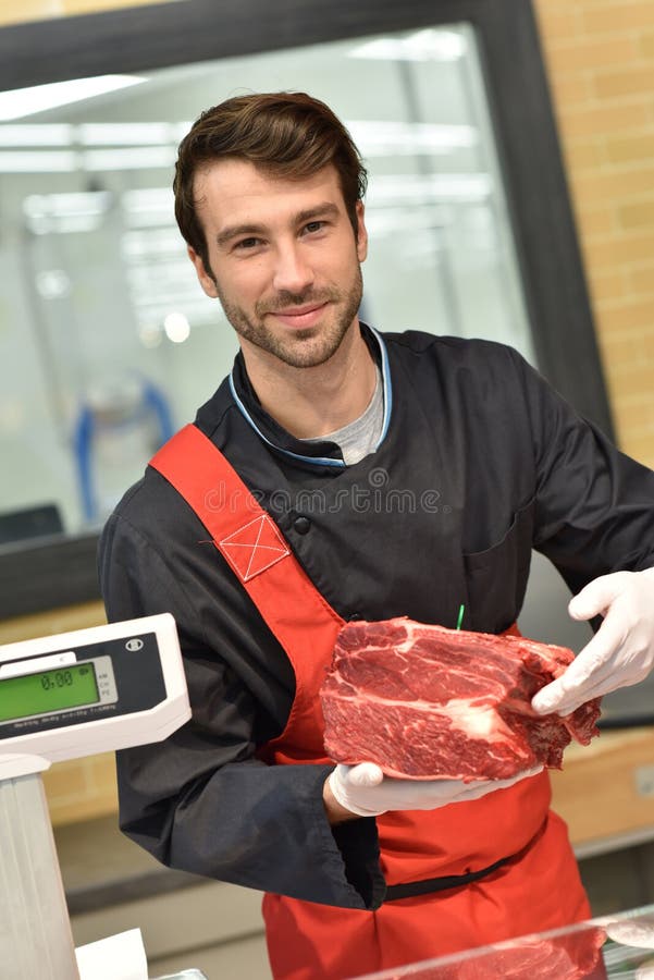 Butcher Serving Meat To Customers Stock Photo - Image of store, male ...