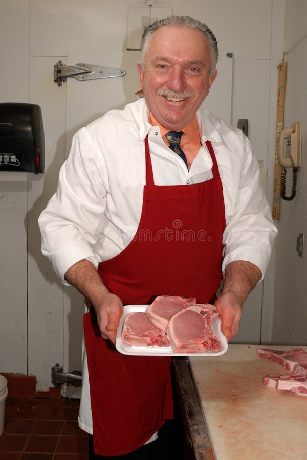 Butcher shows pork chops stock image. Image of food, butcher - 4397839