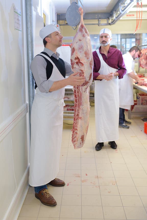 Butcher with side meat stock photo. Image of touching - 83392526