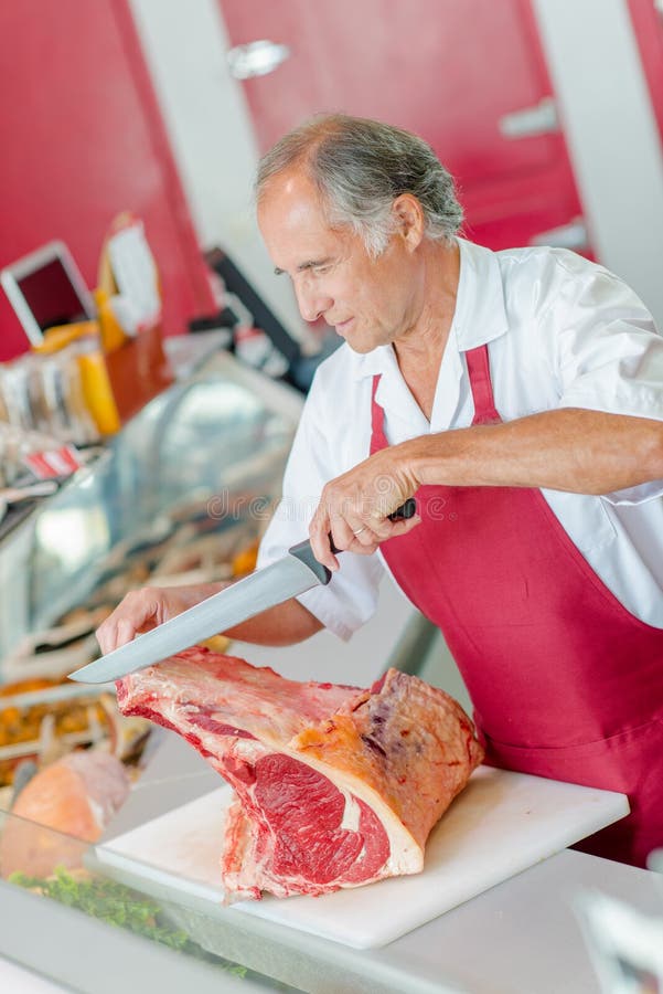Butcher slicing cut beef stock image. Image of preparation - 84998307