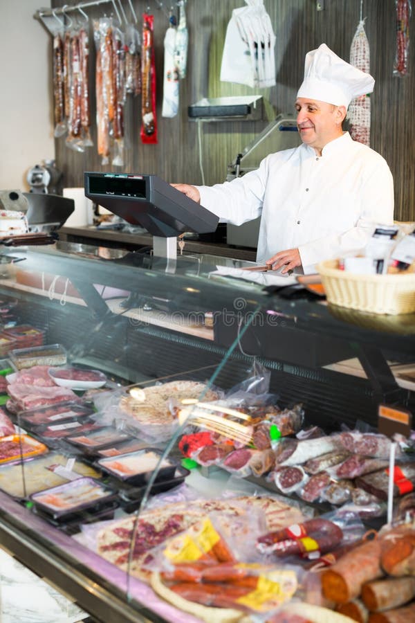 Butcher with Smoked Meat at Counter Stock Image - Image of gourmet ...