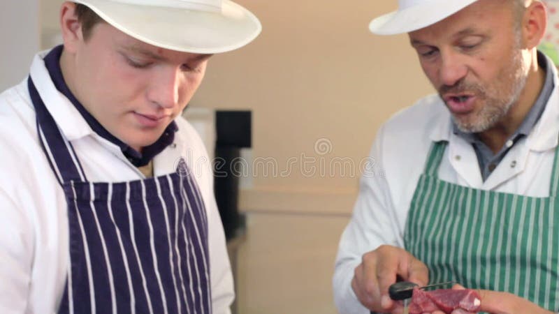 Butcher Teaching Apprentice How To Prepare Meat Stock Video Footage ...