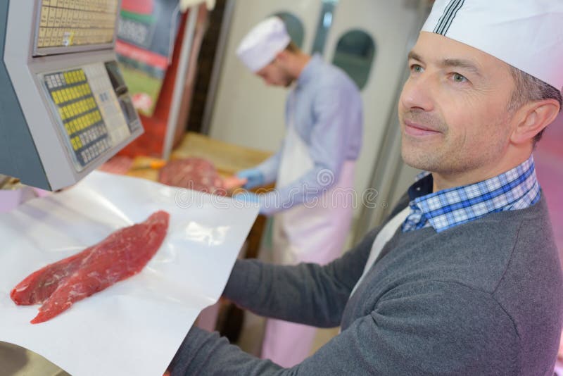 Butcher Teaching Young One How To Sell Meat Stock Image - Image of ...