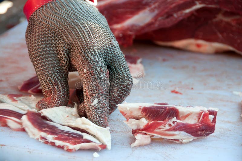 Butcher trimming meat stock photo. Image of mesh, market - 25074830