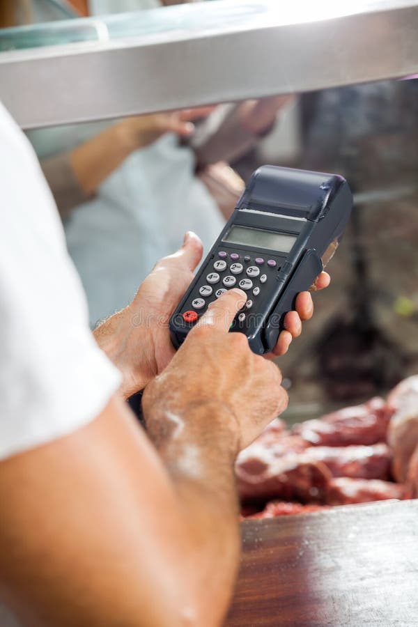 Butcher Using Electronic Card Machine in Shop Stock Image - Image of ...