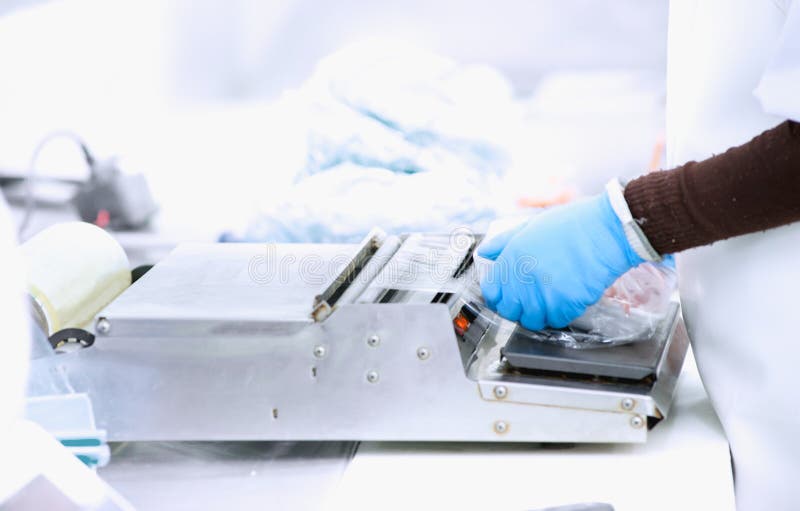 Butcher wrapping meat stock image. Image of nutrition - 61844579