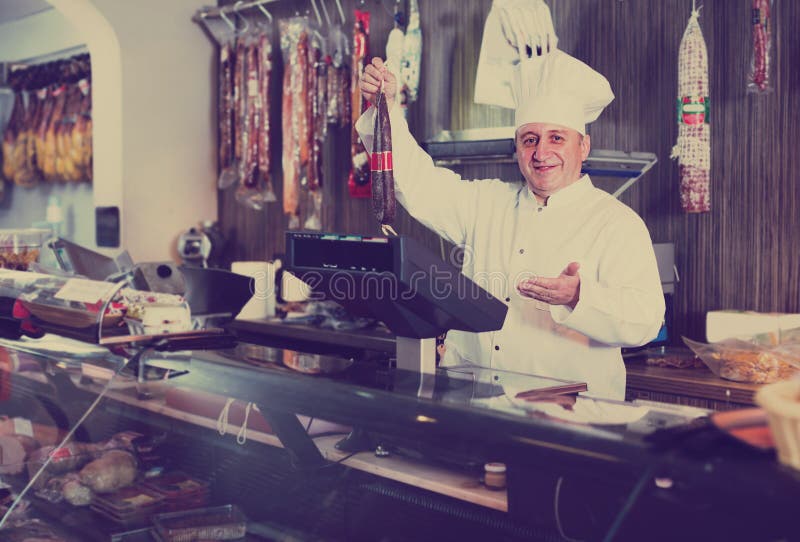 Butcher with Wurst at Counter Stock Photo - Image of sausage, market ...