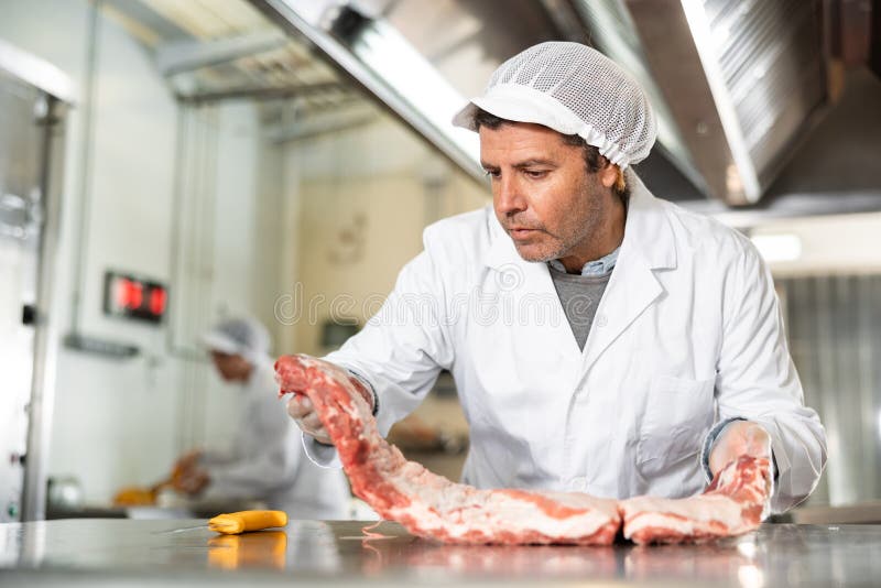 Butchery Worker Preparing Slab of Raw Pork Ribs for Packaging Stock Image - Image of ...